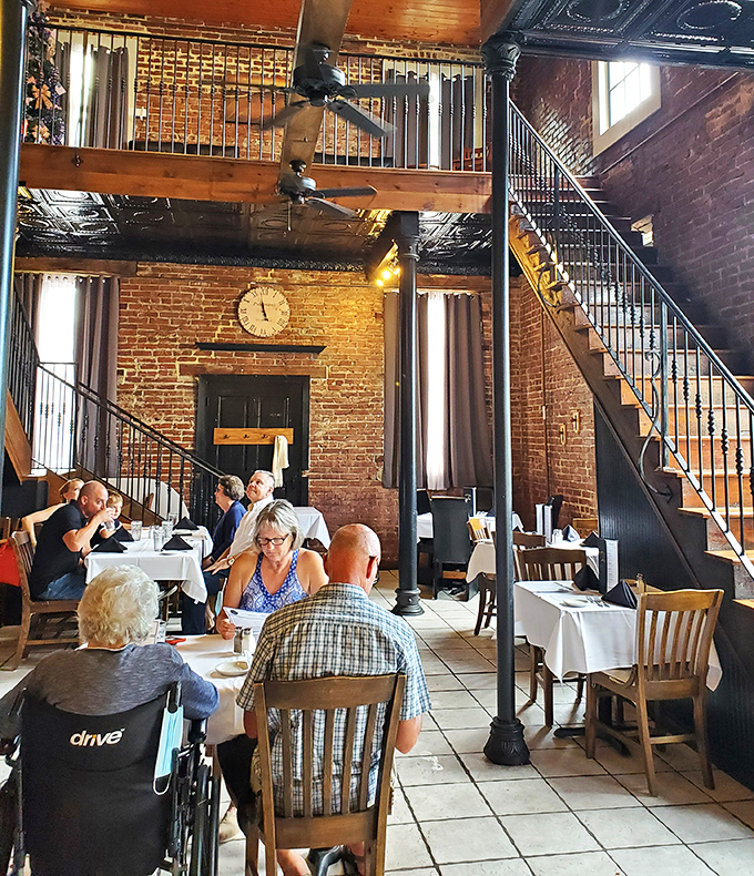 Multi-level dining creates intimate pockets of conversation throughout the space. Every table feels like the best seat in the house.