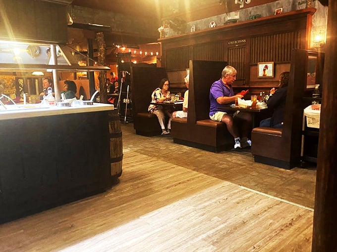 Cozy booths create the perfect backdrop for the main event: serious eating. Notice how everyone's completely focused on their plates? That's steak respect.