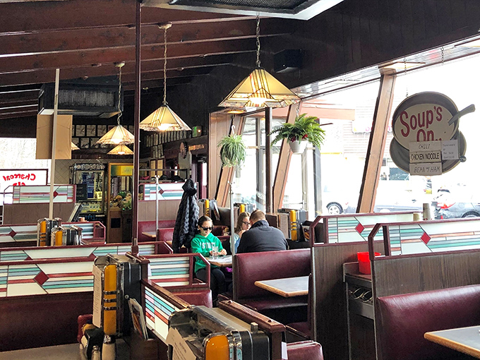 Every booth tells a story at the Charcoal Pit. The mid-century design elements aren't retro &ndash; they're simply preserved to perfection.