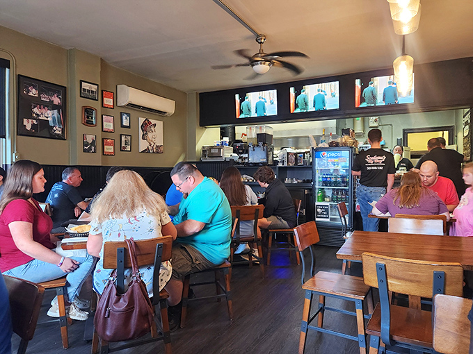 A full house of happy diners, all experiencing that moment of quiet contemplation that comes between ordering and the first heavenly bite.