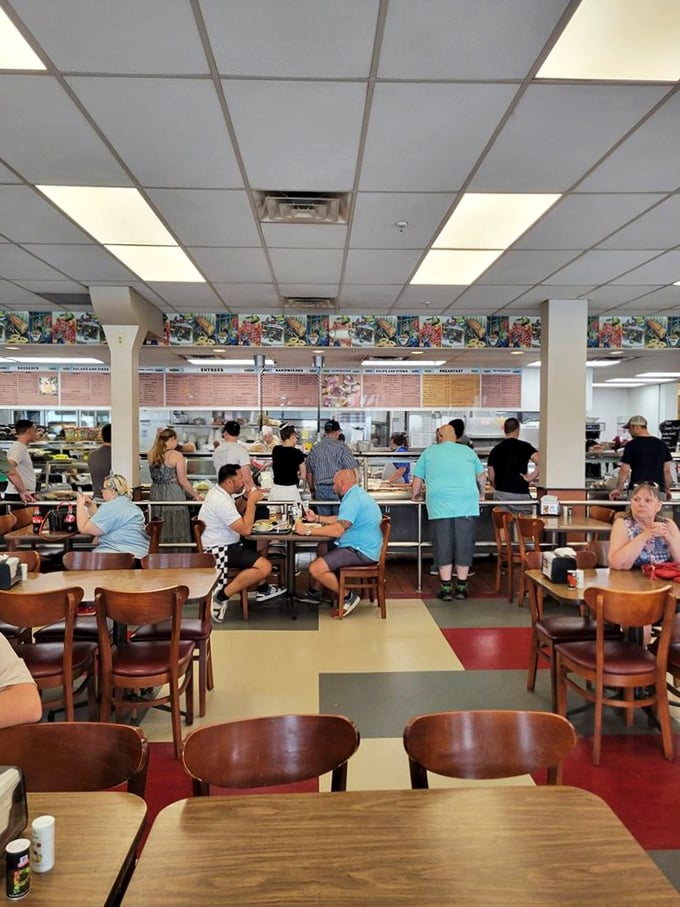Democracy in dining—where suits and t-shirts unite under the banner of hunger. The cafeteria line: humanity's great equalizer since before politics got so complicated.