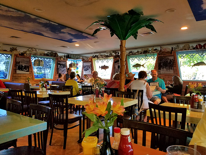Where strangers become friends over seafood. That flower centerpiece is just showing off&mdash;the real color comes from the characters who dine here.