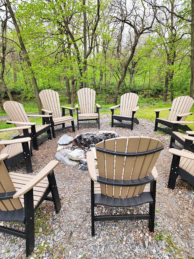 A circle of Adirondack chairs around a fire pit—nature's perfect living room for stargazing, marshmallow roasting, and remembering what conversation was like before smartphones.