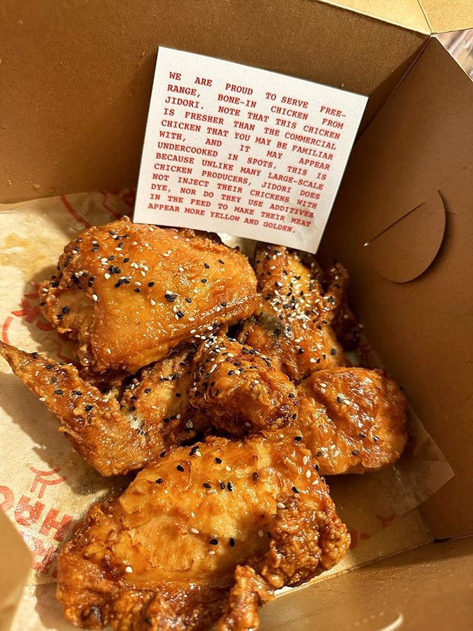 The note card tells the chicken's life story while sesame seeds add texture to that golden crust. This is free-range poultry living its best afterlife.