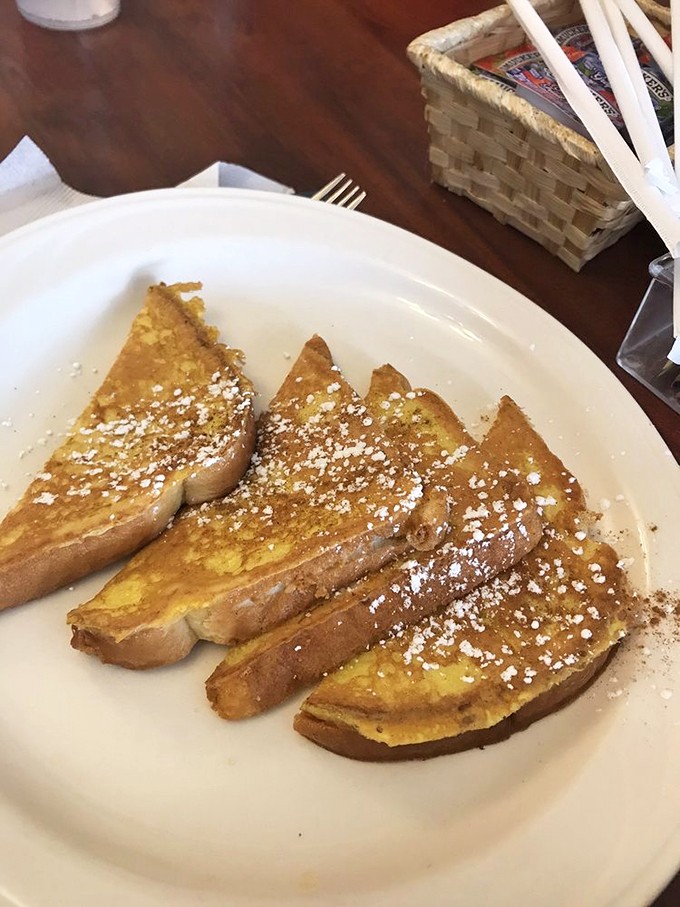 French toast dusted with powdered sugar like fresh snow on Christmas morning &ndash; simple, elegant, and impossible to resist.