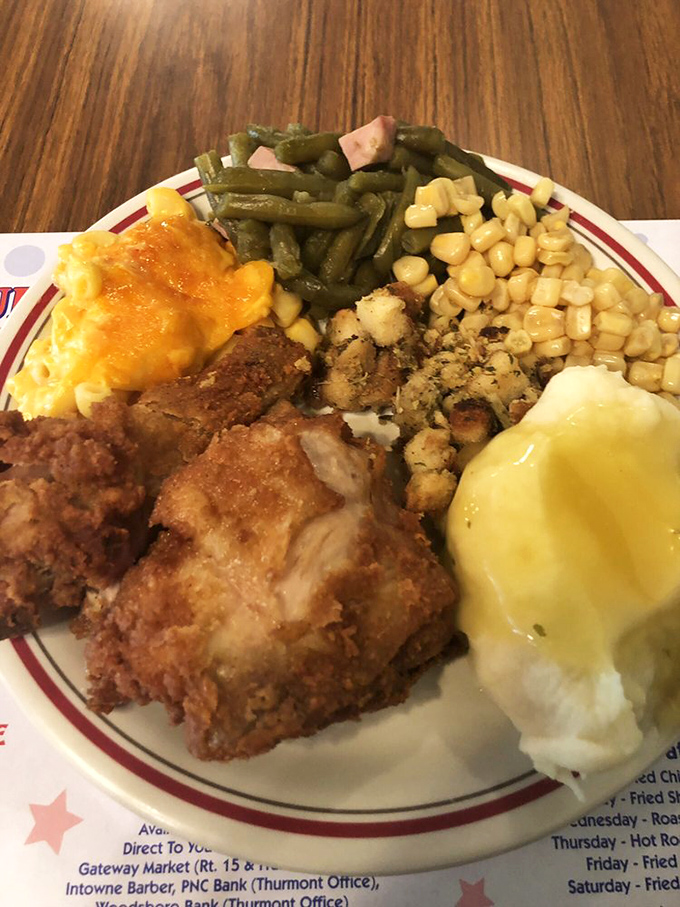 The plate that launched a thousand return visits&mdash;signature fried chicken with that perfect crust, surrounded by sides that refuse to be afterthoughts.