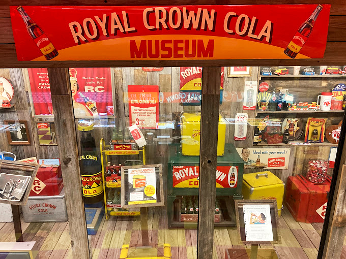 The Royal Crown Cola display brings back memories of summer afternoons when soda felt like liquid magic in a glass bottle.