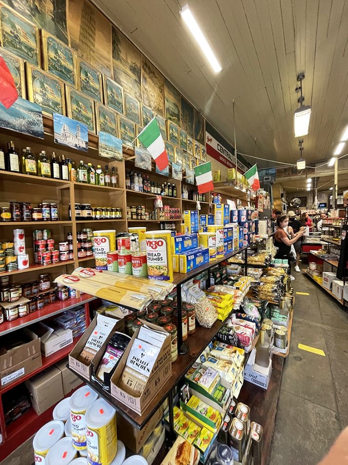 Italian flags and imported goods line the shelves like an ambassador's pantry, reminding you this sandwich has diplomatic immunity from all diet restrictions.