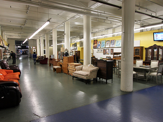 The cavernous interior feels like a department store from another era, where furniture islands create neighborhoods of possibility throughout the space.