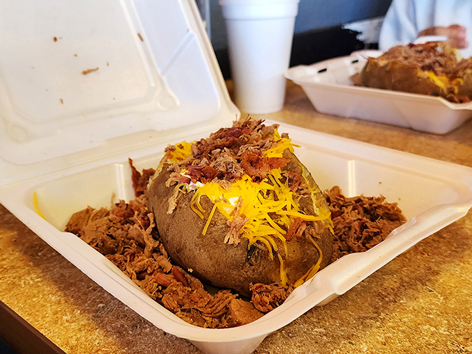 This loaded potato isn't just dressed&mdash;it's wearing its Sunday best with a crown of pulled pork and cheese that stretches for days.