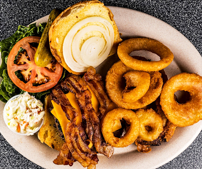 A proper diner burger comes with proper onion rings&mdash;golden, crispy, and large enough to double as delicious bracelets.