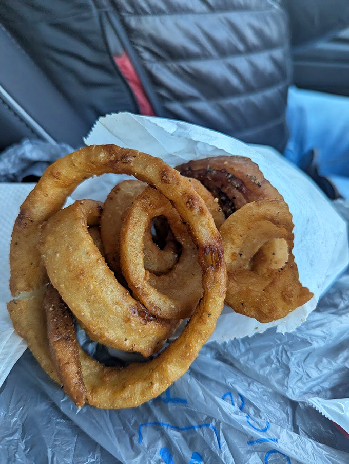 These onion rings aren't just fried&mdash;they're transformative golden halos that crunch with the satisfaction of a thousand potato chips.