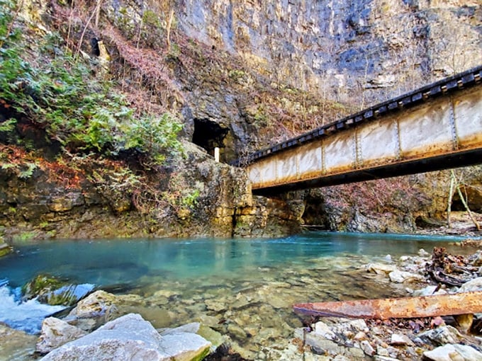 The impossibly blue waters beneath the tunnel create a natural infinity pool that no resort could ever hope to replicate.