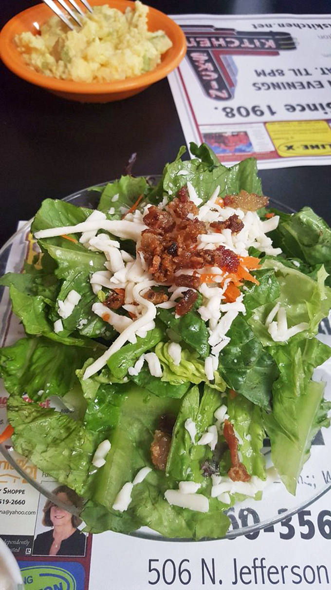 A garden-fresh salad topped with cheese and bacon bits&mdash;because sometimes virtuous eating deserves a little rebellion.
