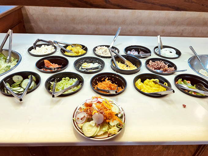 The salad bar&mdash;a colorful prelude to barbecue bliss. These fresh fixings provide the perfect counterpoint to the smoky main event.