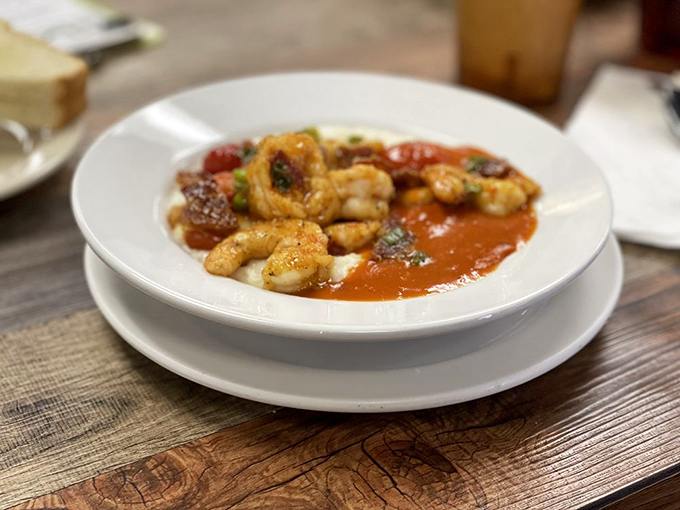 Shrimp and grits that look like they belong in a museum of Southern cuisine&mdash;plump shrimp lounging in a tomato gravy hot tub.