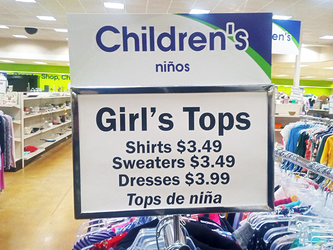 Bilingual signage guides shoppers through the children's section, where $3.49 can dress a growing child in style without growing your credit card bill.