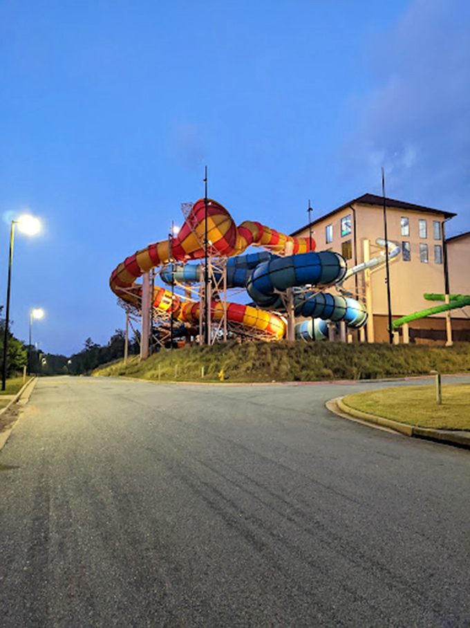 Colorful water slide tubes twist around the exterior like giant candy straws, promising sweet thrills for the brave souls inside.