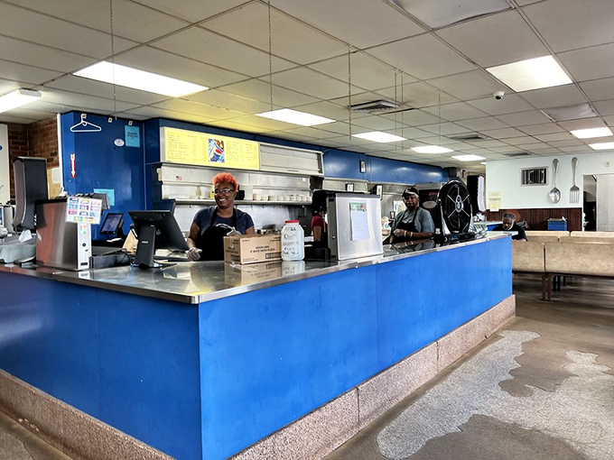 The counter staff&mdash;unsung heroes who've mastered the choreography of assembling Rochester's most famous culinary creation with practiced precision.