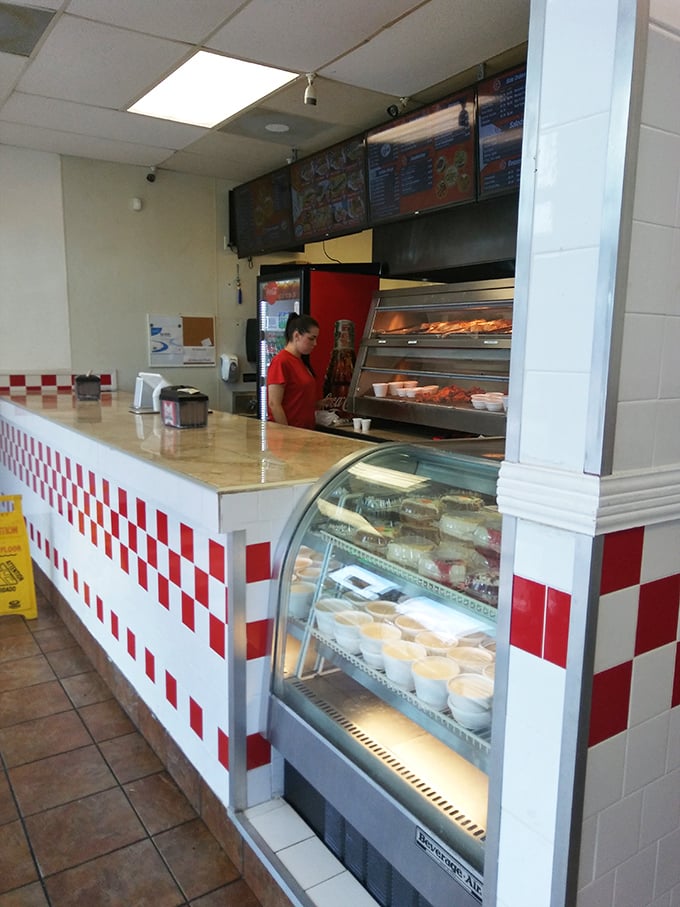 Behind the counter, where the magic happens &ndash; fresh chicken transforming into golden treasures under watchful eyes.