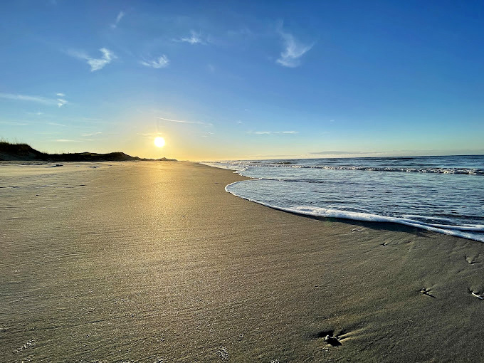 Dawn at Bear Island &ndash; that magical moment when the beach belongs to early risers and shell collectors before the crowds arrive.
