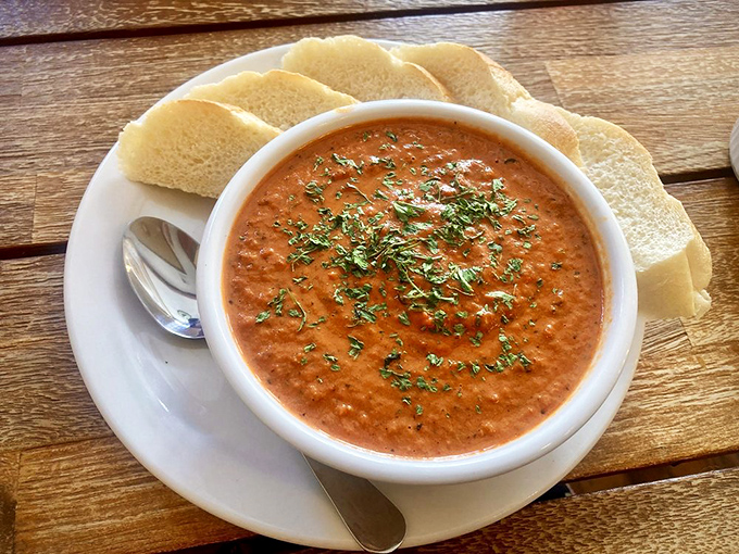A bowl of tomato bisque that looks so velvety and rich, it could probably qualify for its own tax bracket.