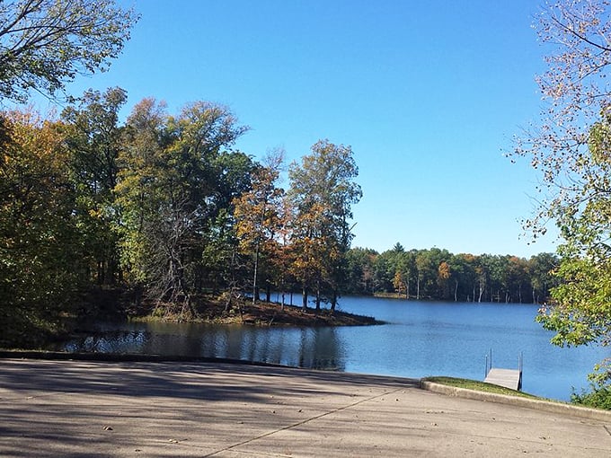 Where land meets lake in perfect harmony. This tranquil peninsula jutting into crystal waters captures Indiana's natural beauty in one frame.