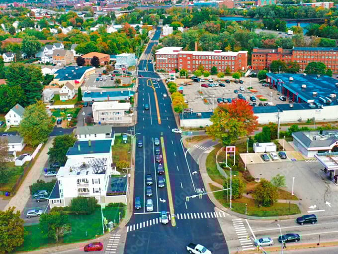 The aerial view of Bedford reveals a patchwork of green spaces and charming neighborhoods &ndash; suburban living at its finest.