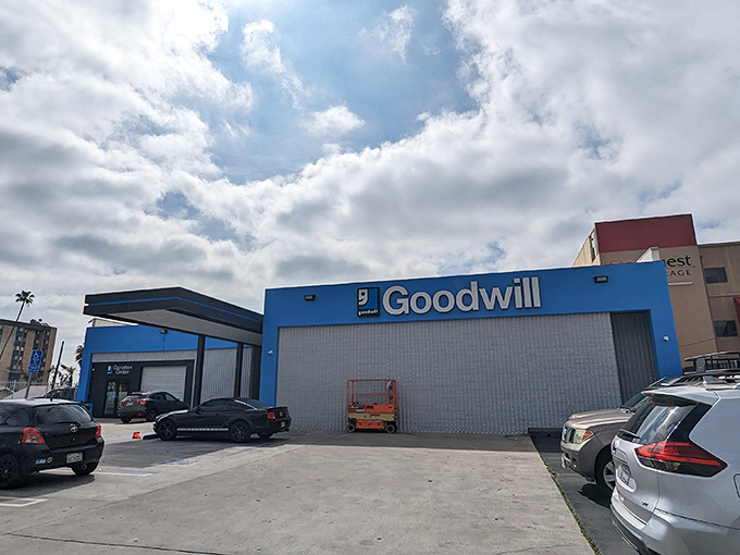 Goodwill's bright blue exterior on Sunset Boulevard stands out like a sapphire in the urban landscape.