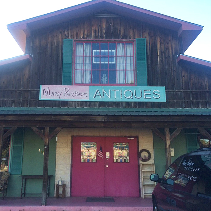 Mary Parker Antiques' barn-style building with its colorful accents promises character inside. Rustic charm with a splash of personality.