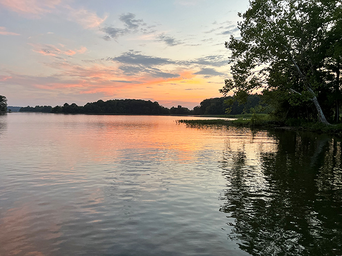Roland Cooper's glassy waters reflect clouds with mirror-like precision, nature's own infinity pool.