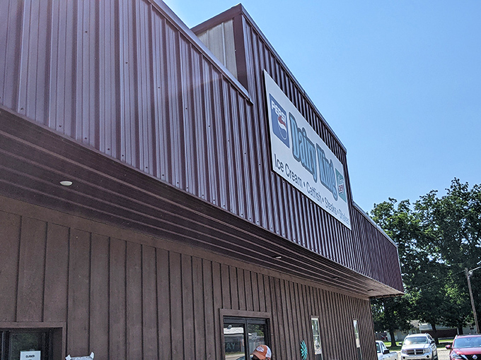 Those colorful flower decorations hint at the sweet treats waiting inside this unassuming roadside gem.