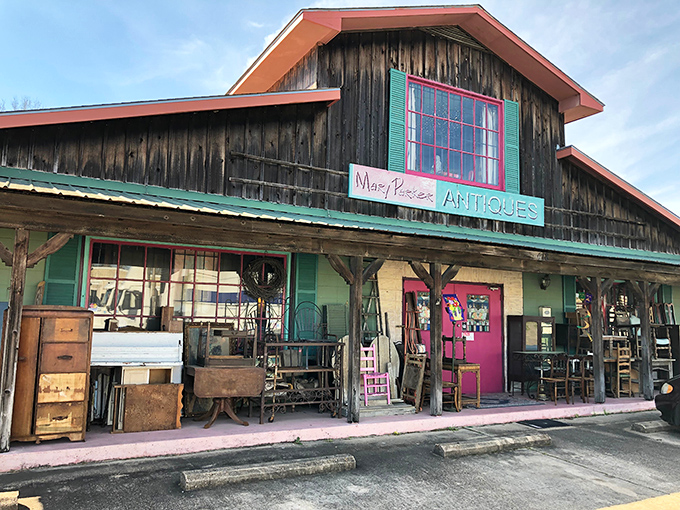The wooden exterior and vibrant pink doors set expectations high. Like a country farmhouse that decided to become an art gallery.