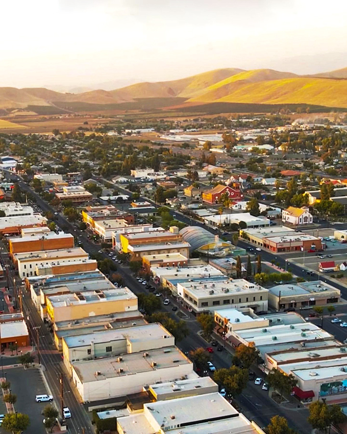 Golden hills embrace Porterville at sunset, proving that Mother Nature's light show remains the best free entertainment in California.