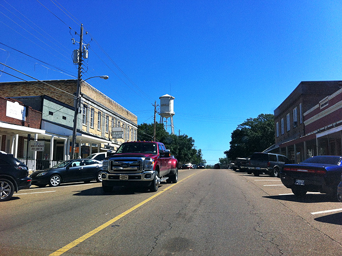Trees frame Woodville's quiet streets, where historic buildings whisper secrets of Mississippi's storied past.