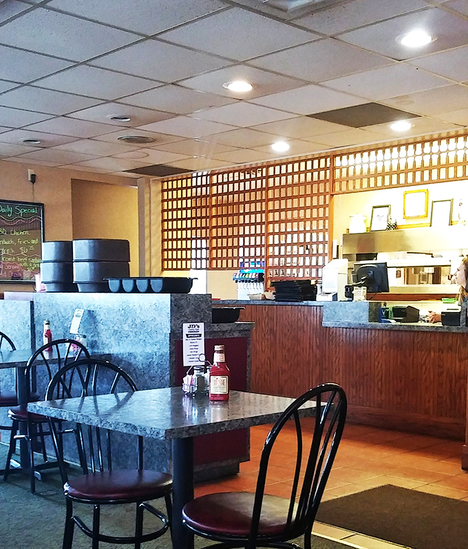 The heart of the operation, where chicken dreams come true. That wooden lattice divider has witnessed decades of delicious decisions being made.