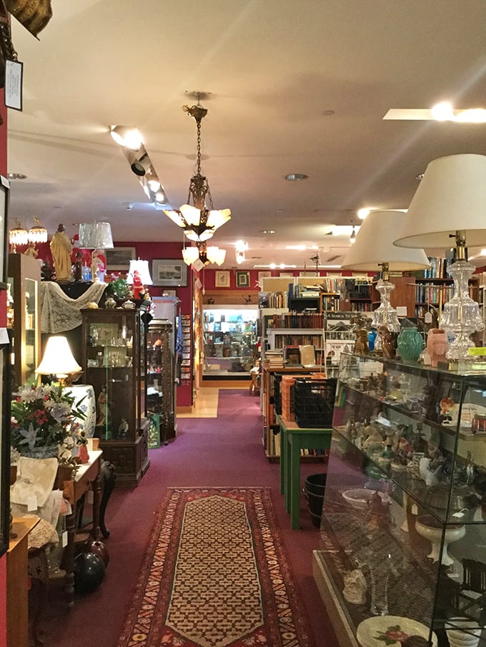 A corridor of art that feels like walking through someone's curated memories. Those red walls could tell stories if they could talk.