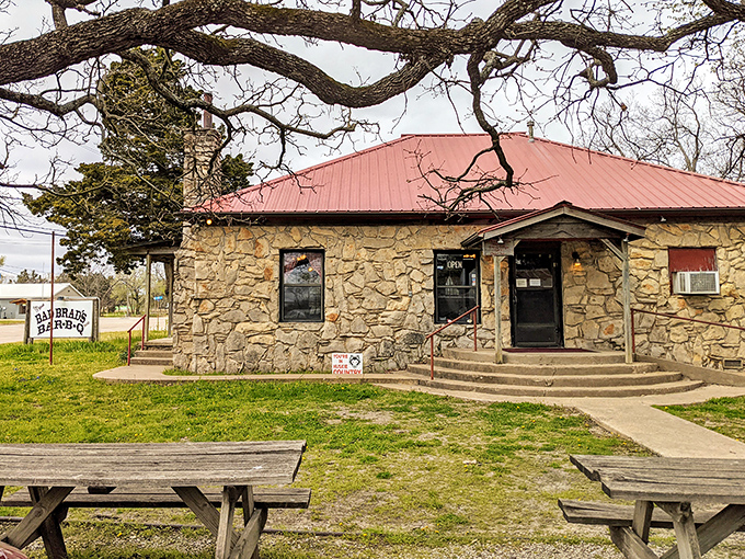 Bad Brad's Bar-B-Q sits like a stone sentinel, promising smoky delights that will have you contemplating a permanent move to Osage County.
