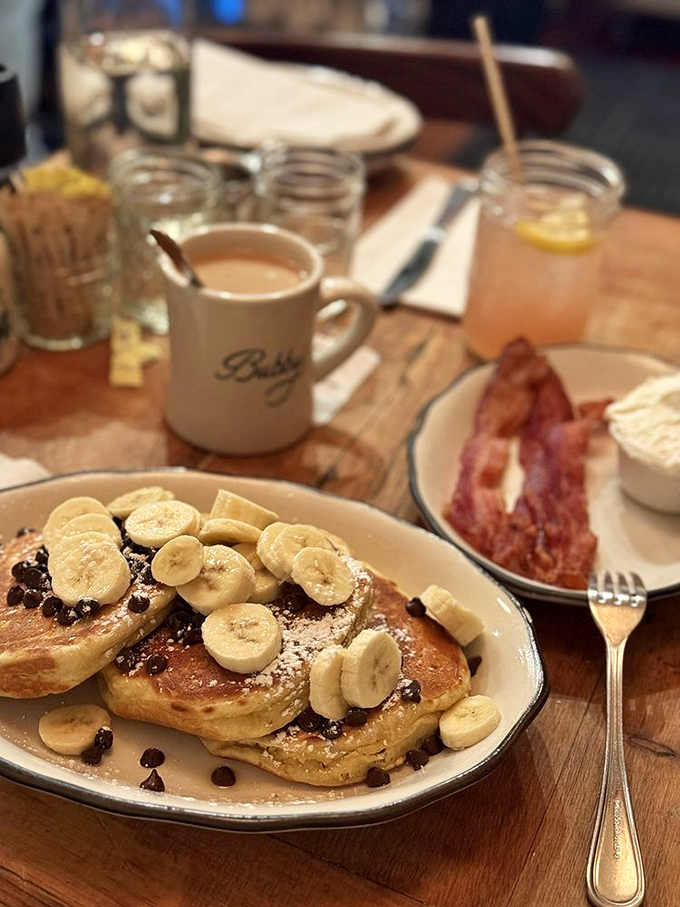 Banana chocolate chip pancakes with a side of bacon&mdash;proof that sometimes the best things in life involve a little sweet, a little salt, and zero regrets.
