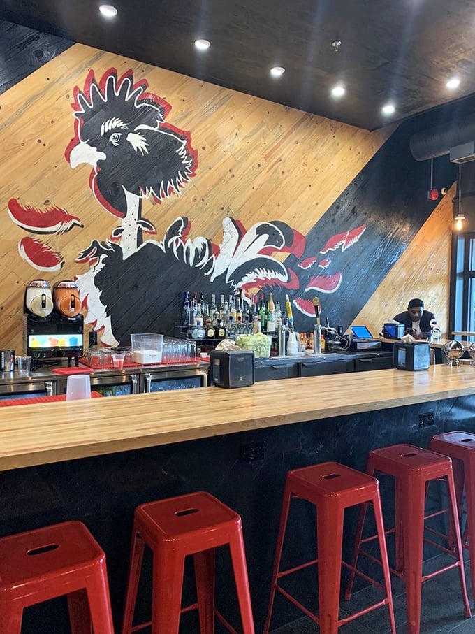 The rooster mural watches over the bar like a taco guardian, ensuring your margarita is properly paired with your meal choices.