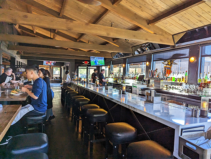 A bar that beckons both serious cocktail enthusiasts and casual sippers alike, with wooden beams overhead that feel like a warm, boozy hug.