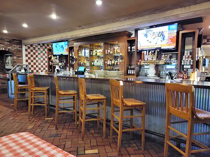 The bar area combines rustic charm with practical function – because sometimes you need a drink while waiting for chicken this good.