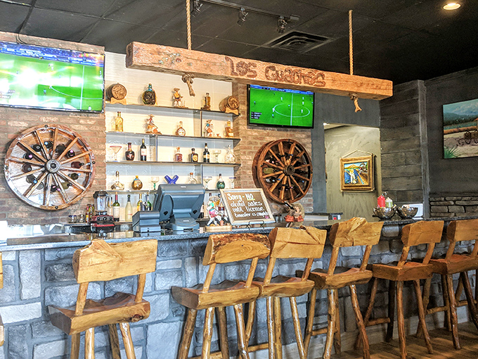 The bar area combines rustic charm with soccer on TV—proving that some combinations, like tequila and lime, are simply meant to be.