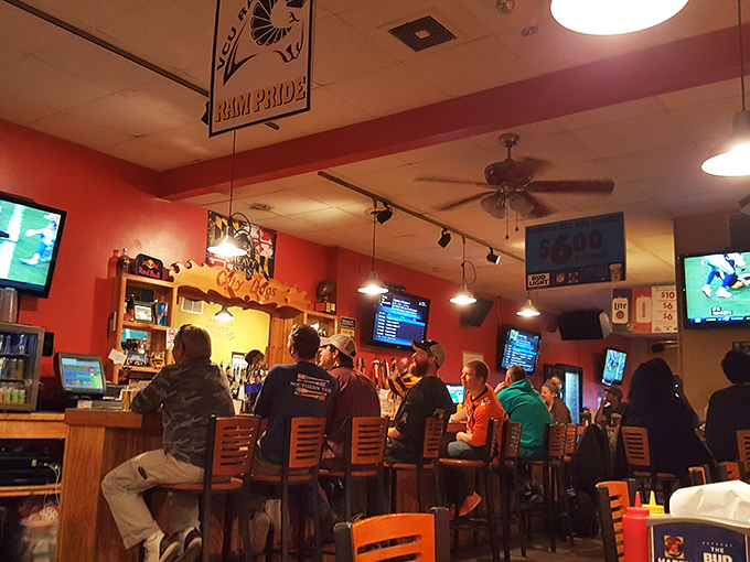 The bustling bar on game day, where strangers become temporary best friends bonded by touchdowns and excellent tater tots.
