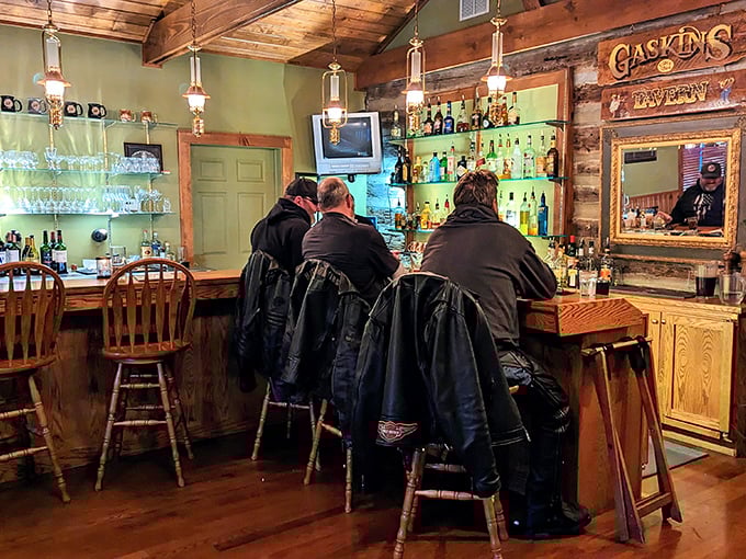 The tavern's well-stocked bar proves even frontier-style cabins understand the importance of proper libations.