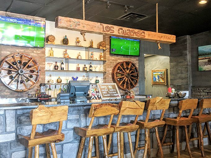 The bar area balances rustic charm with modern convenience &ndash; wagon wheels meet flat-screens, creating the perfect backdrop for that ice-cold cerveza.