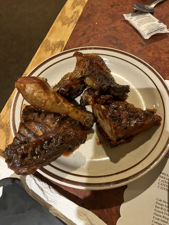 Meat candy for grown-ups. The bark on those ribs has the kind of complex flavor that makes vegetarians momentarily question their life choices.