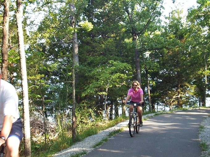 Cycling the shoreline path offers all the joy of a scenic drive with none of the traffic. Plus, you can justify that extra helping of Branson BBQ later.