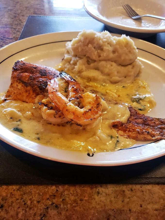 Blackened fish meets creamy sauce with shrimp standing guard. This plate is the ocean's finest offerings having a party with your taste buds.