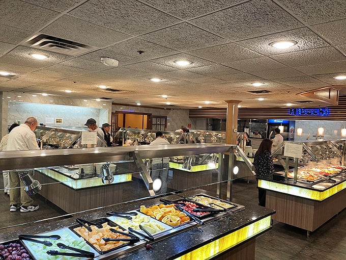 The buffet area: where food dreams come true and diet plans go to die. Those sneeze guards are the only thing standing between civilization and chaos.